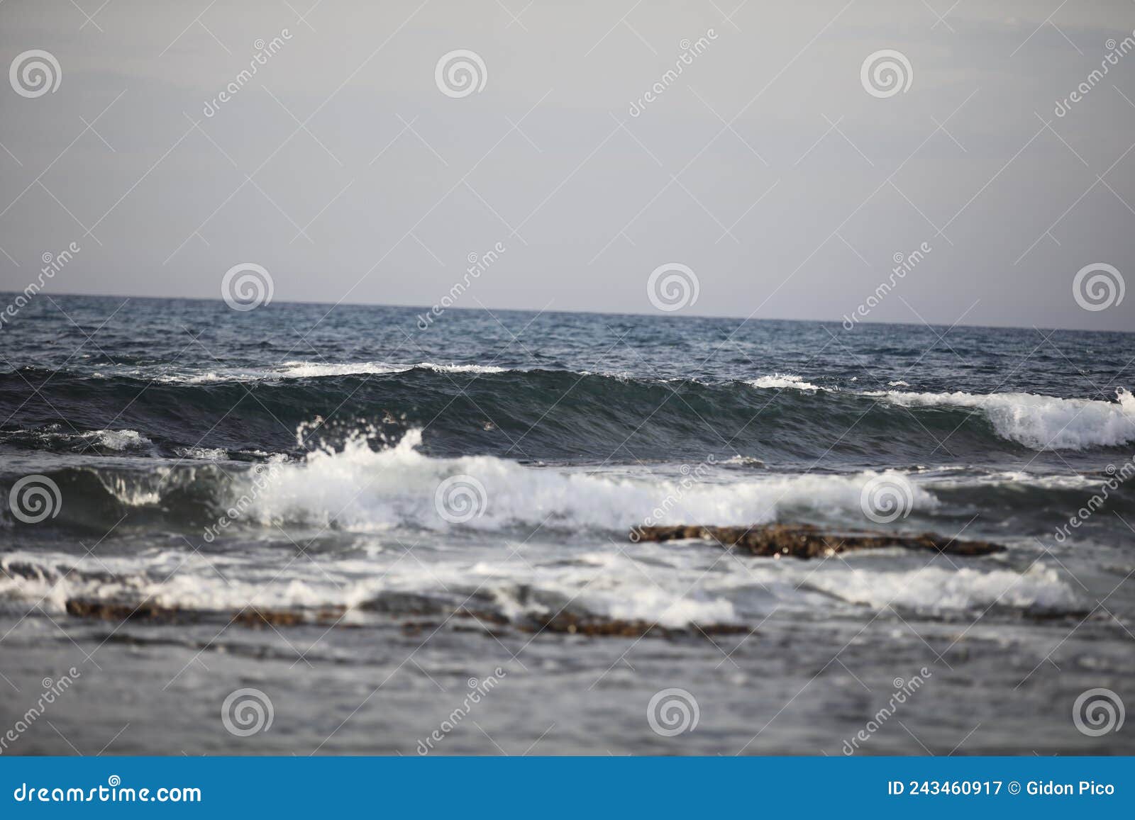 Low Waves on the Shore of a Beach High Quality Stock Image - Image of ...