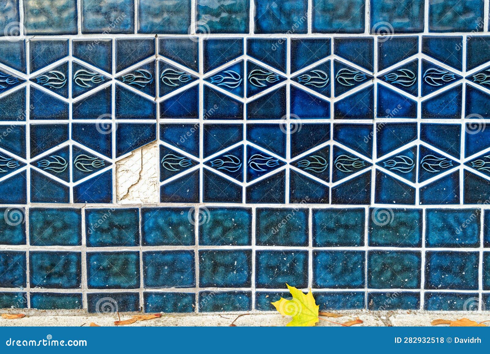 The Lower Section of a Cracked Tile Wall on the Exterior of a Building ...