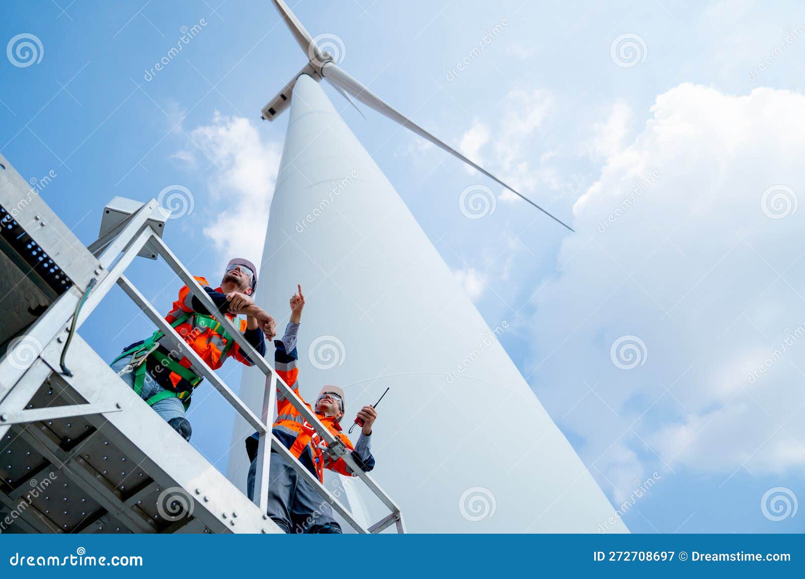 Lower View of Two Engineers or Technician Workers Stand on Base of Big ...
