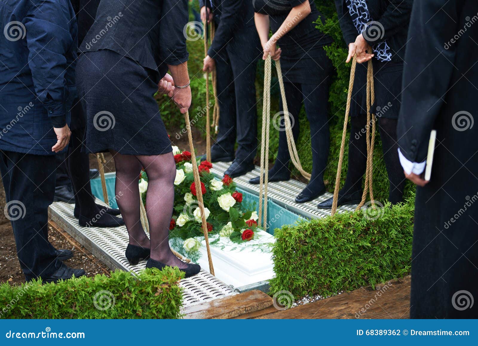 Lowering coffin stock photo. Image of human, flowers - 68389362