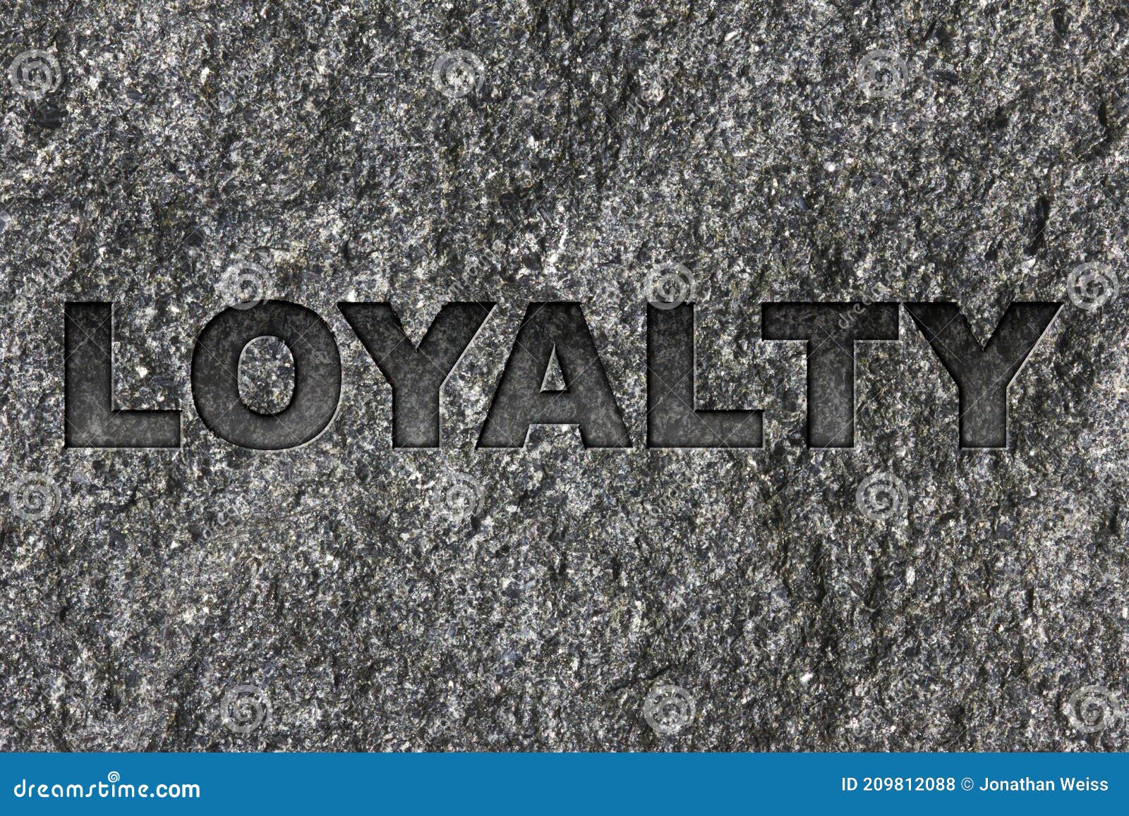 Loyalty Etched in Bold, Dark Gray Text on Black Granite Stock Photo ...