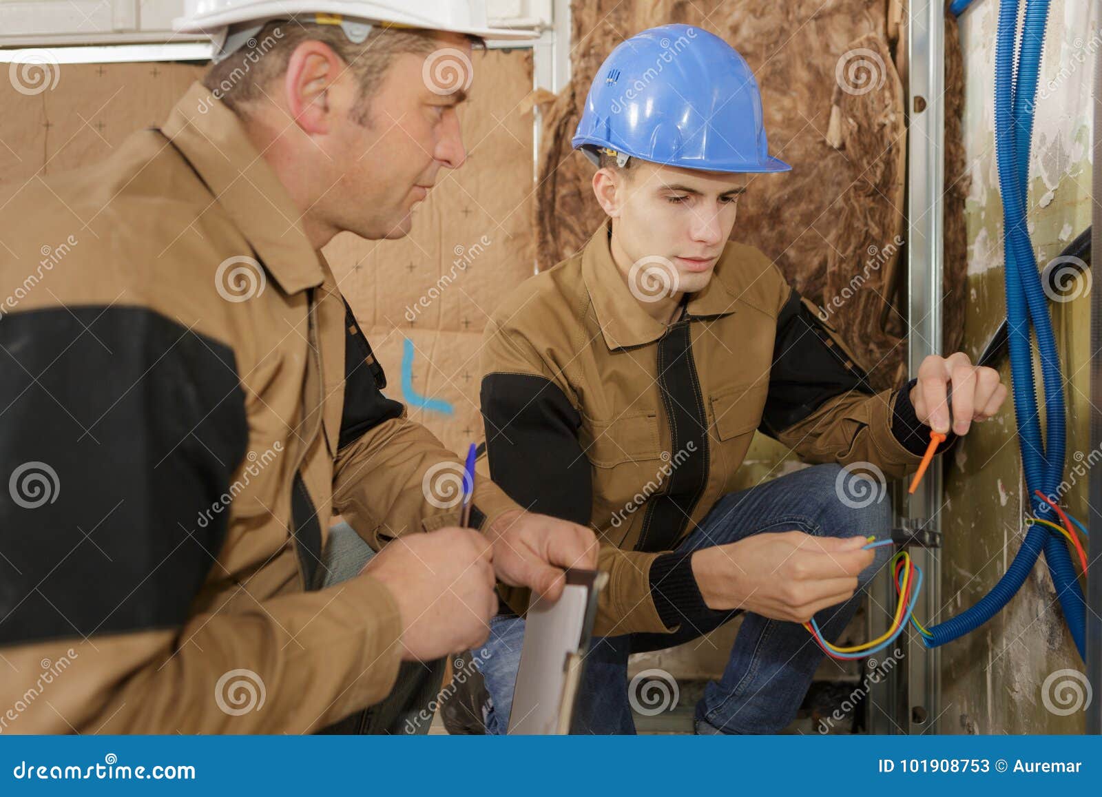 Ltwo Workers Fixing Cable in Construction Site Stock Image - Image of ...