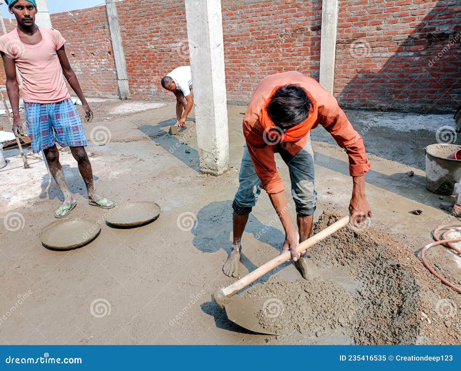 Indian Workers Doing Construction Work Manually on Floor Using a Shovel ...