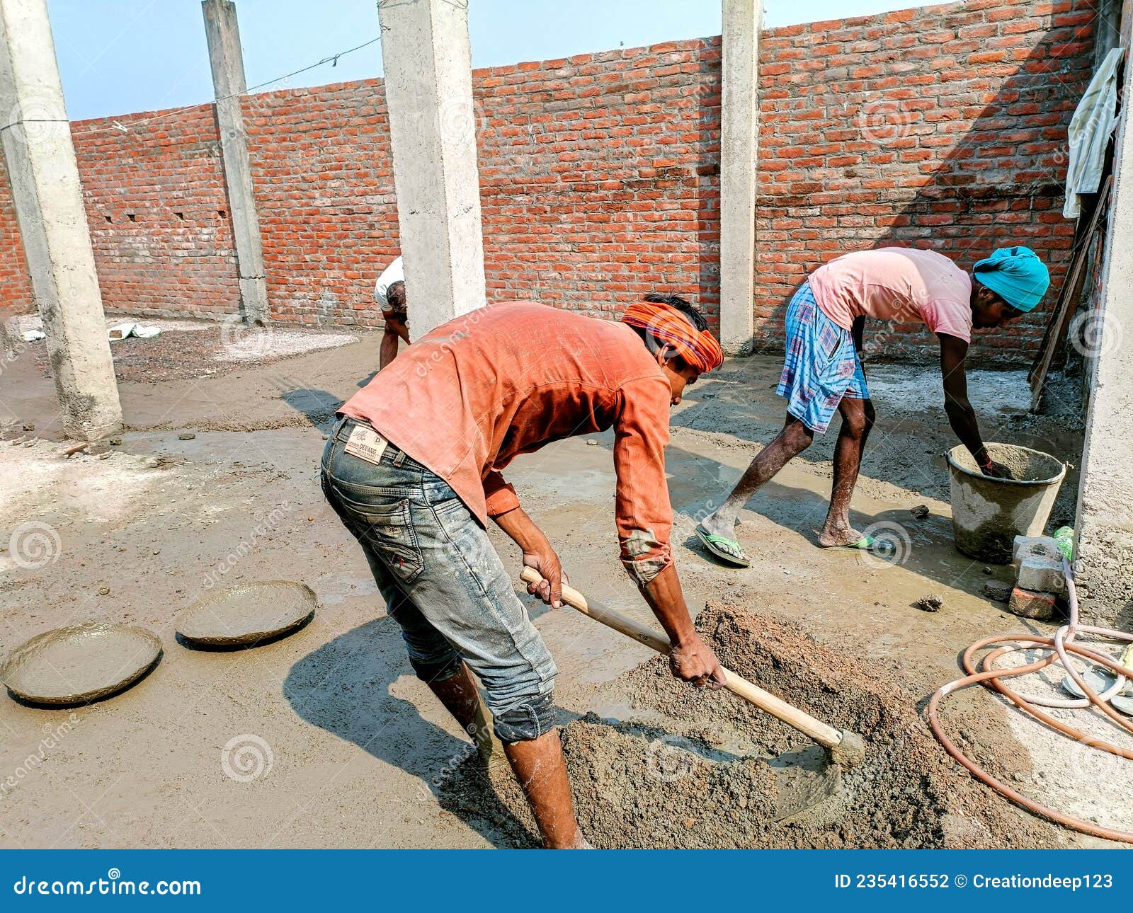 Indian Workers Doing Construction Work Manually on Floor Using a Shovel ...