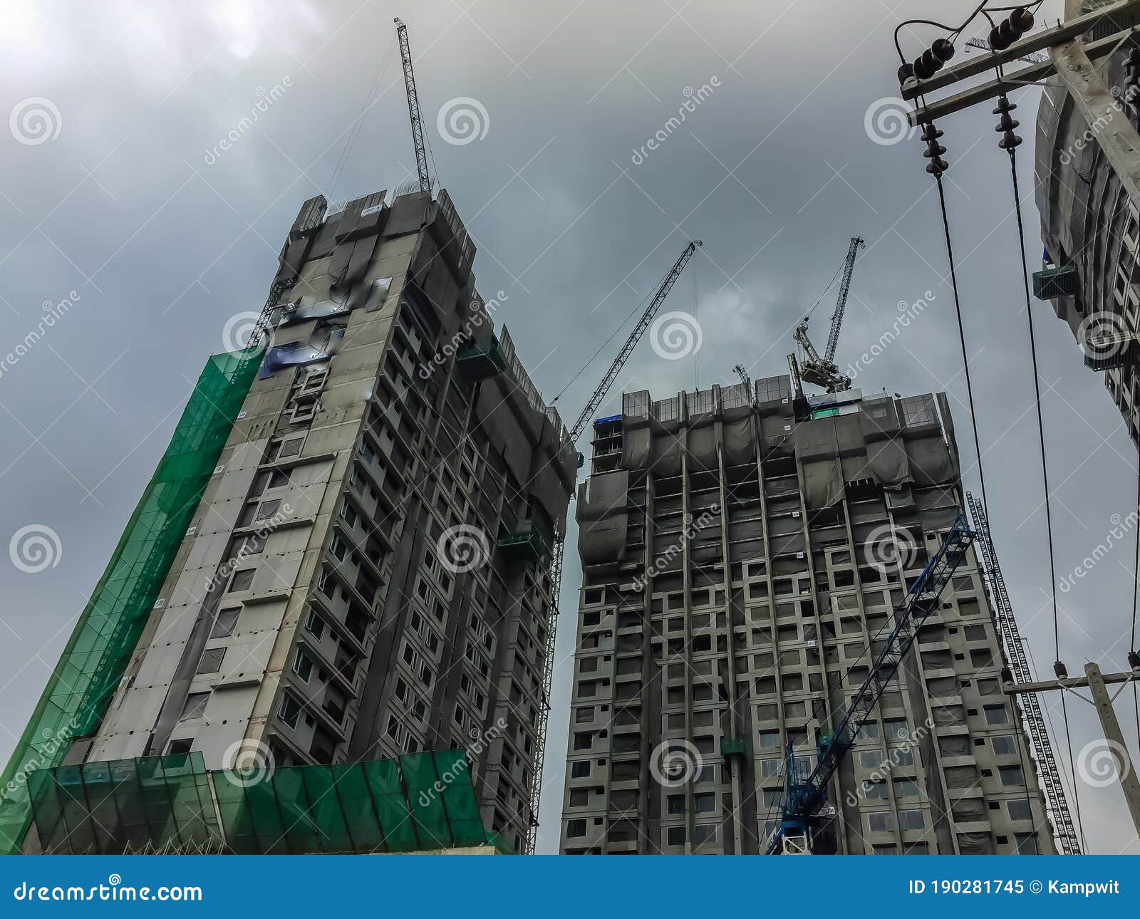 Luffing Jib Tower Crane At High Rise Building Construction Site Project ...