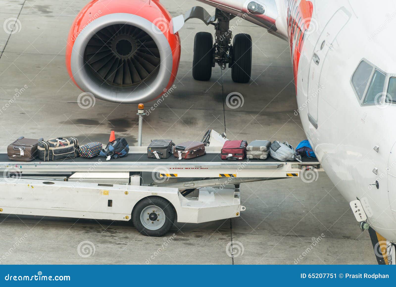 Air Plane In Airport Terminal Loading Passengers And Cargo Luggage ...