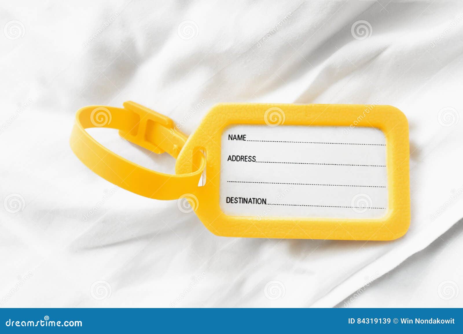 Luggage tag label on bed stock image. Image of identity - 84319139