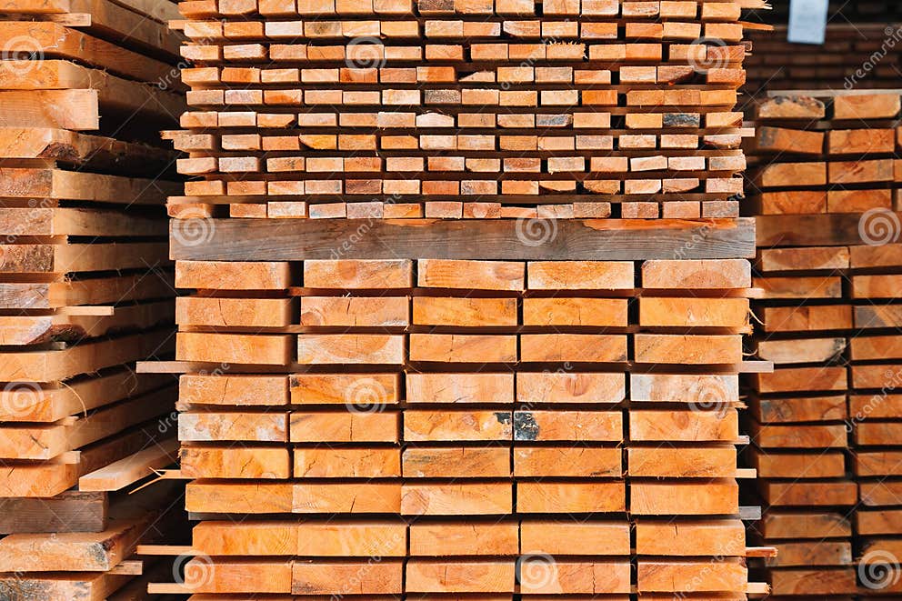 Lumber in a Large Warehouse. Wooden Boards in the Stack Stock Photo ...
