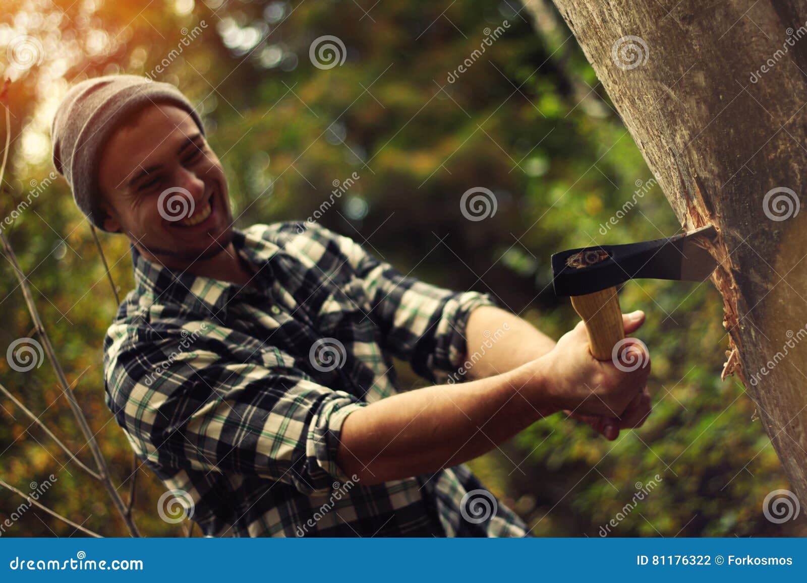 Lumberjack Chopping a Tree Trunk in the Forest Stock Photo - Image of ...