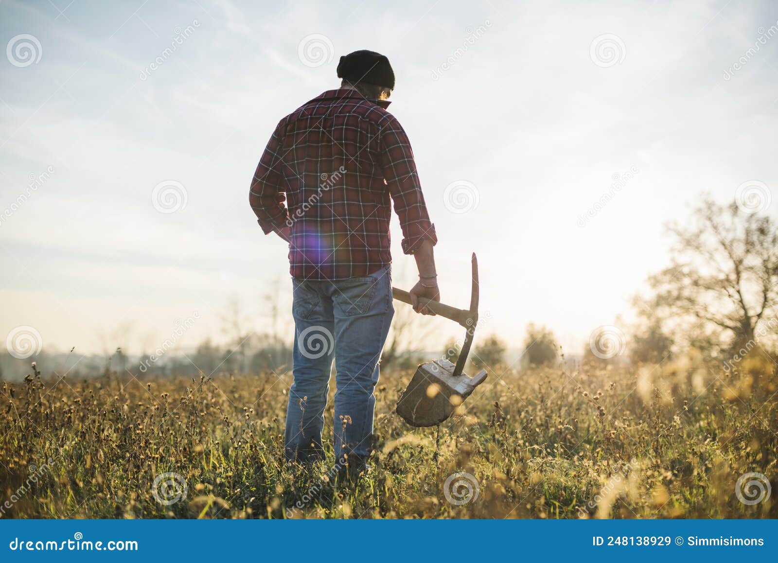 Lumberjack Standing in the Field at Sunset Stock Image - Image of ...