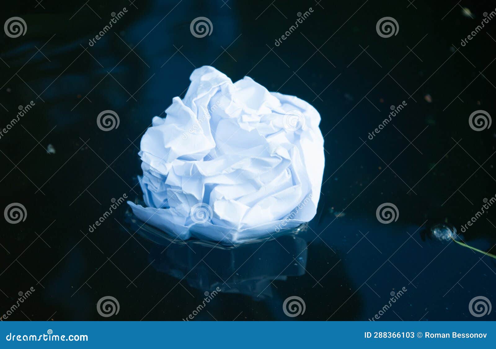 A Lump of Paper Floats in the Water Stock Image - Image of crumpled ...
