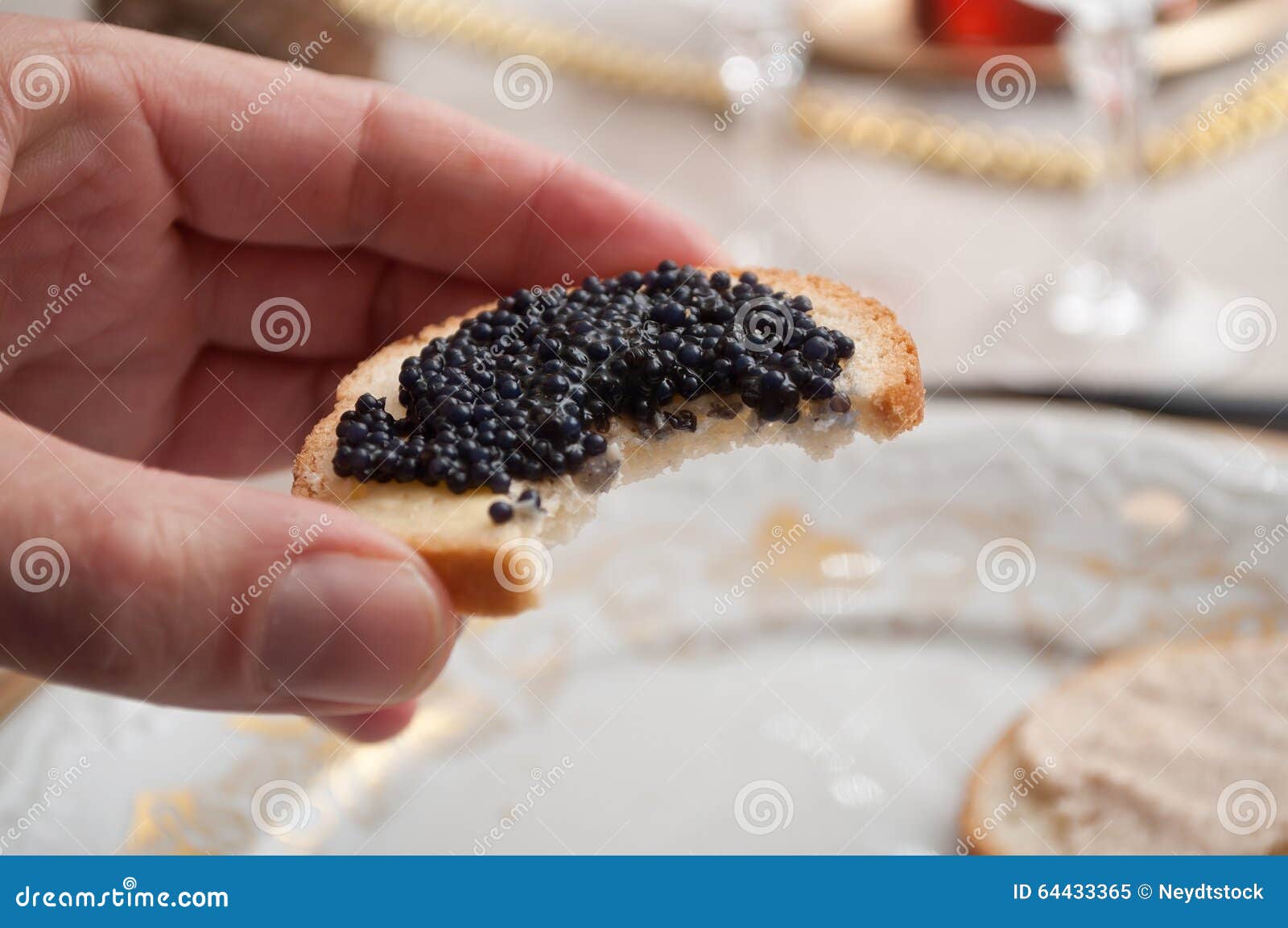 Lumpfish roe in hand stock image. Image of cream, black - 64433365