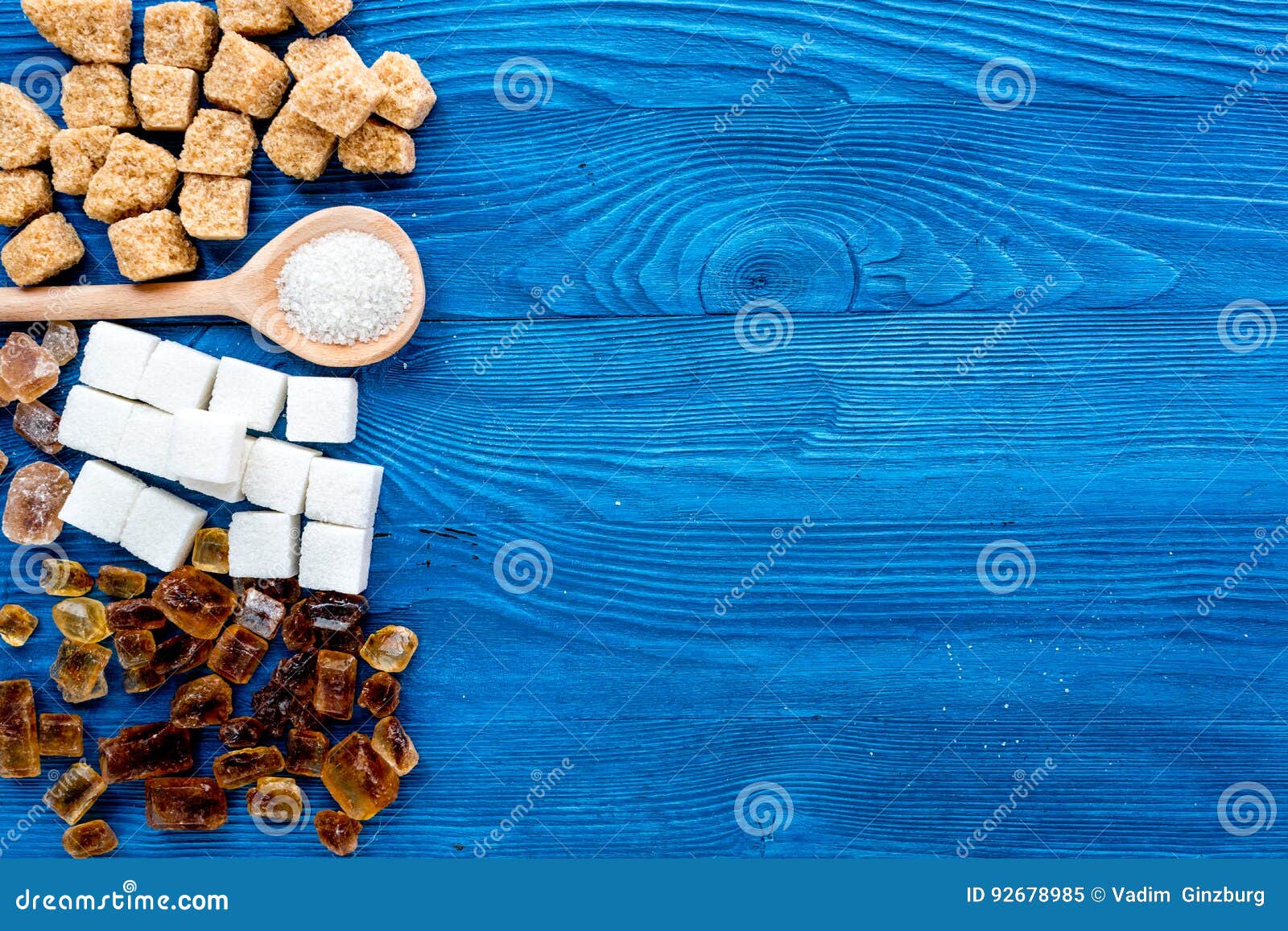 Lumps and Sanding Sugar for Sweets on Blue Kitchen Table Background Top ...