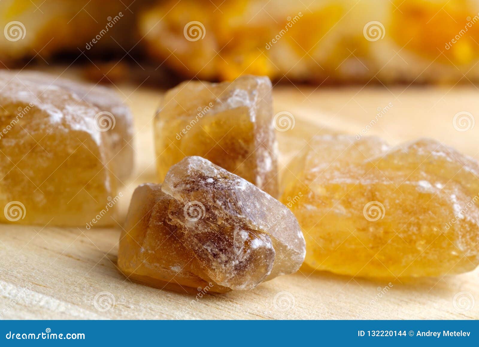 Lumpy Cane Caramel Sugar is Located on a Wooden Substrate Stock Photo ...