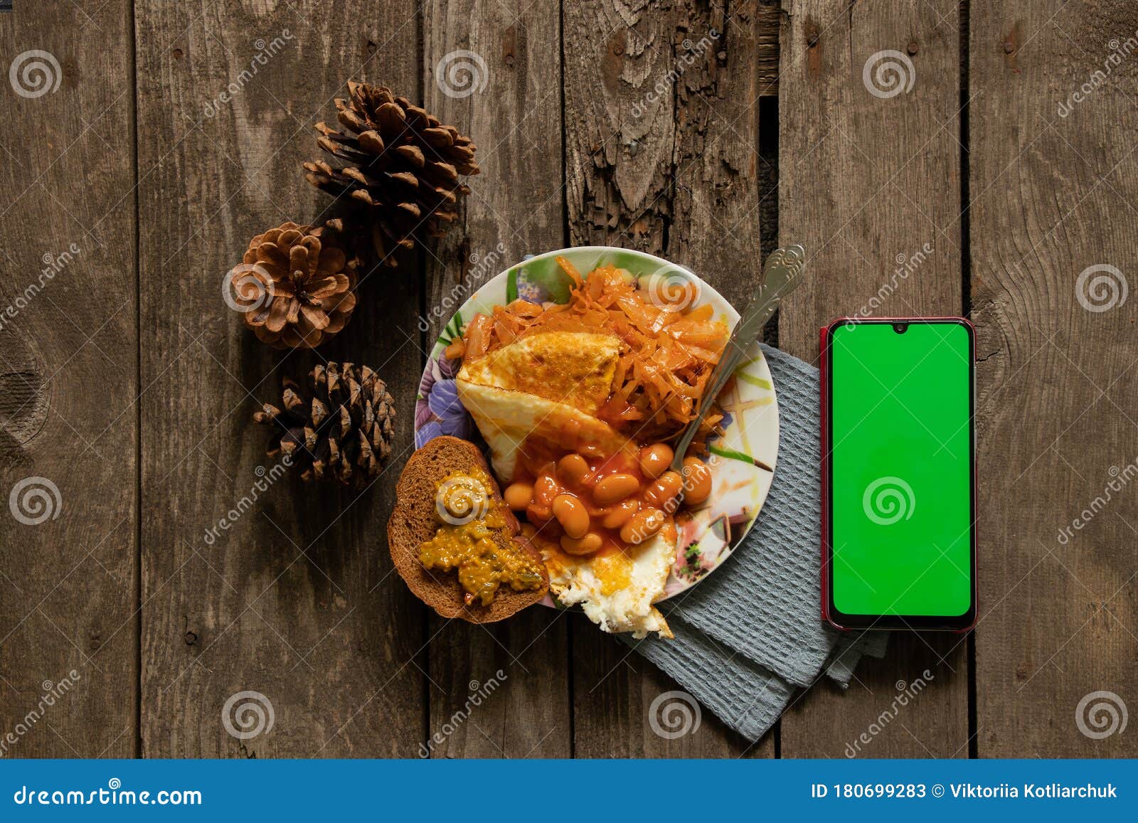 Lunch Plate with Fried Egg and Salad and a Phone with a Green Screen on ...