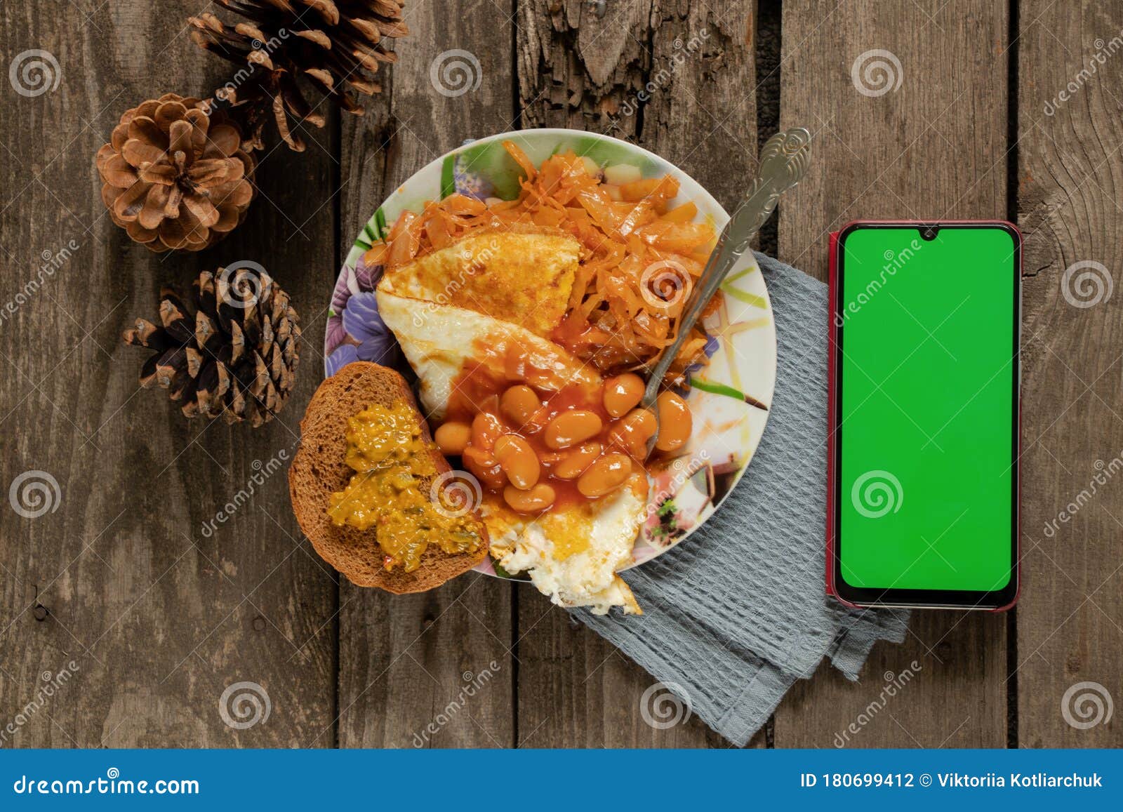 Lunch Plate with Fried Egg and Salad and a Phone with a Green Screen on ...