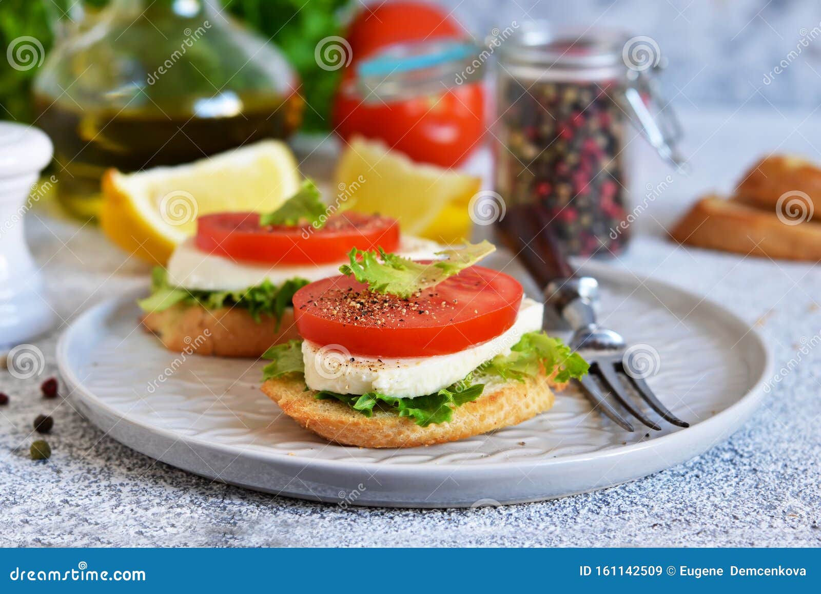 Lunch Time! Sandwich with Tomatoes and Mozzarella on the Kitchen Table ...