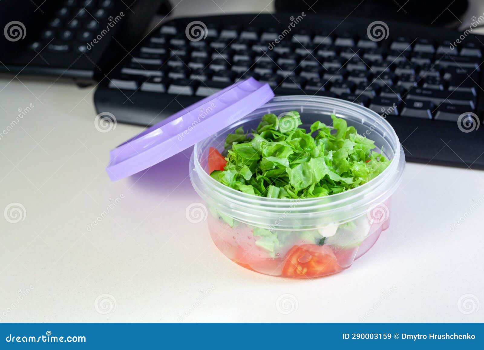 Lunch on Work Place. Food Box Container with Fresh Salad on the Working ...