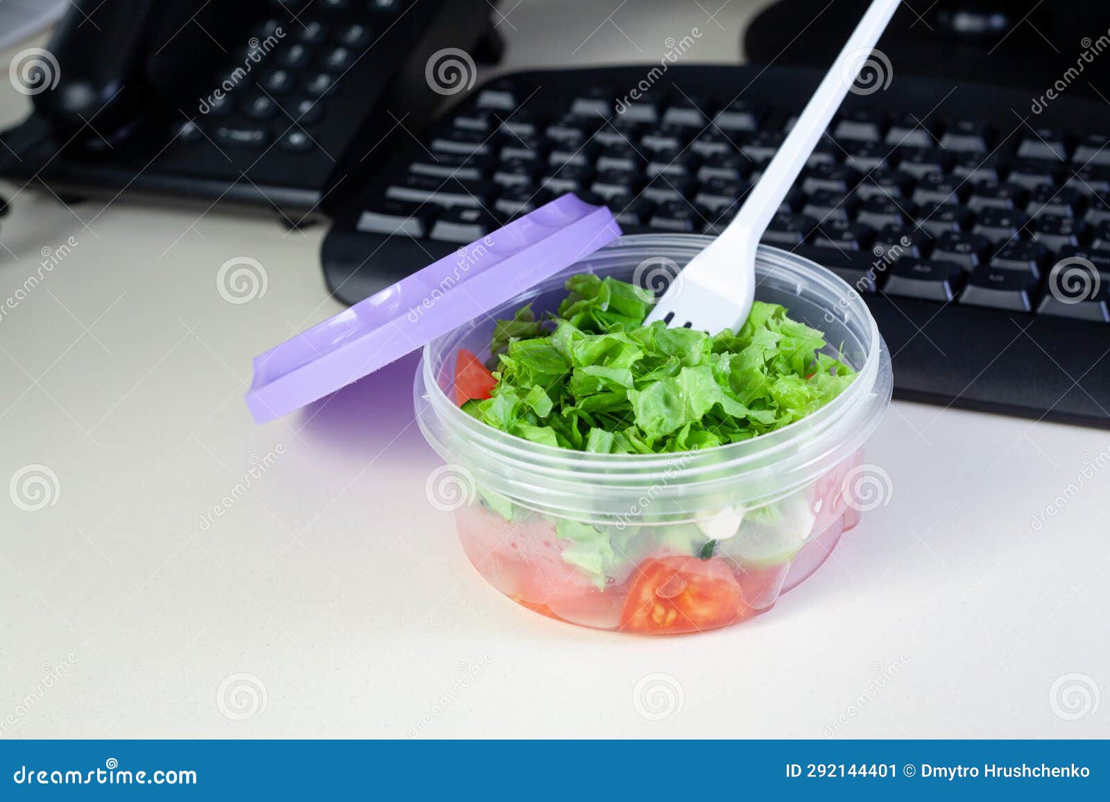 Lunch on Work Place. Food Box Container with Fresh Salad on the Working ...