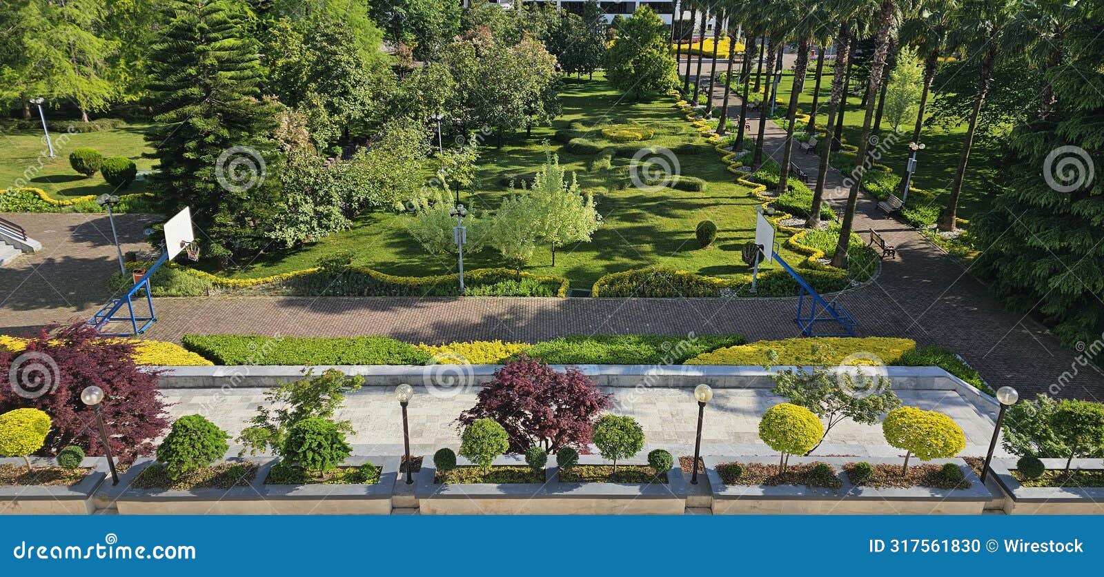 Lush Park with Greenery, Benches, and a Pathway Stock Photo - Image of ...