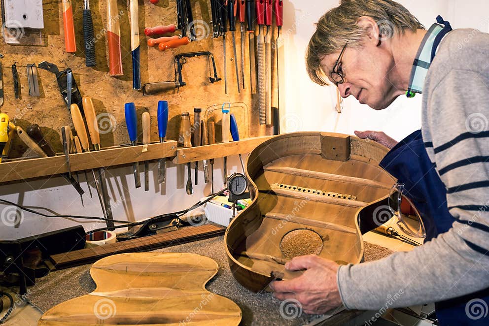 Luthier Checking the Body of an Acoustic Guitar Stock Image - Image of ...