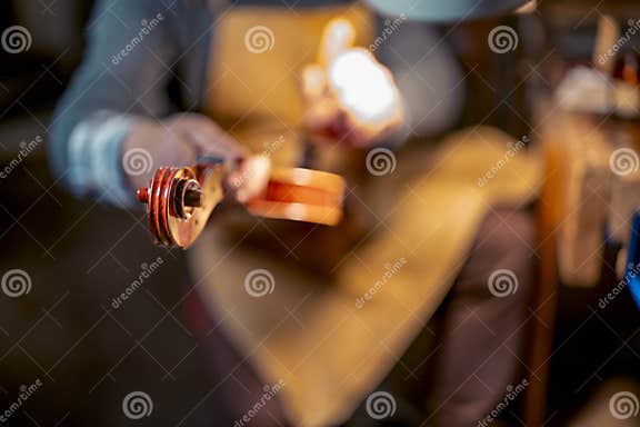 Luthier Holding a Violin Scroll in His Workshop Stock Image - Image of ...