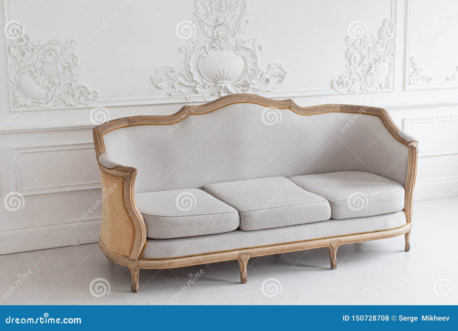 Luxurious Bright Rococo Interior with a Large Sofa and Stucco on the ...