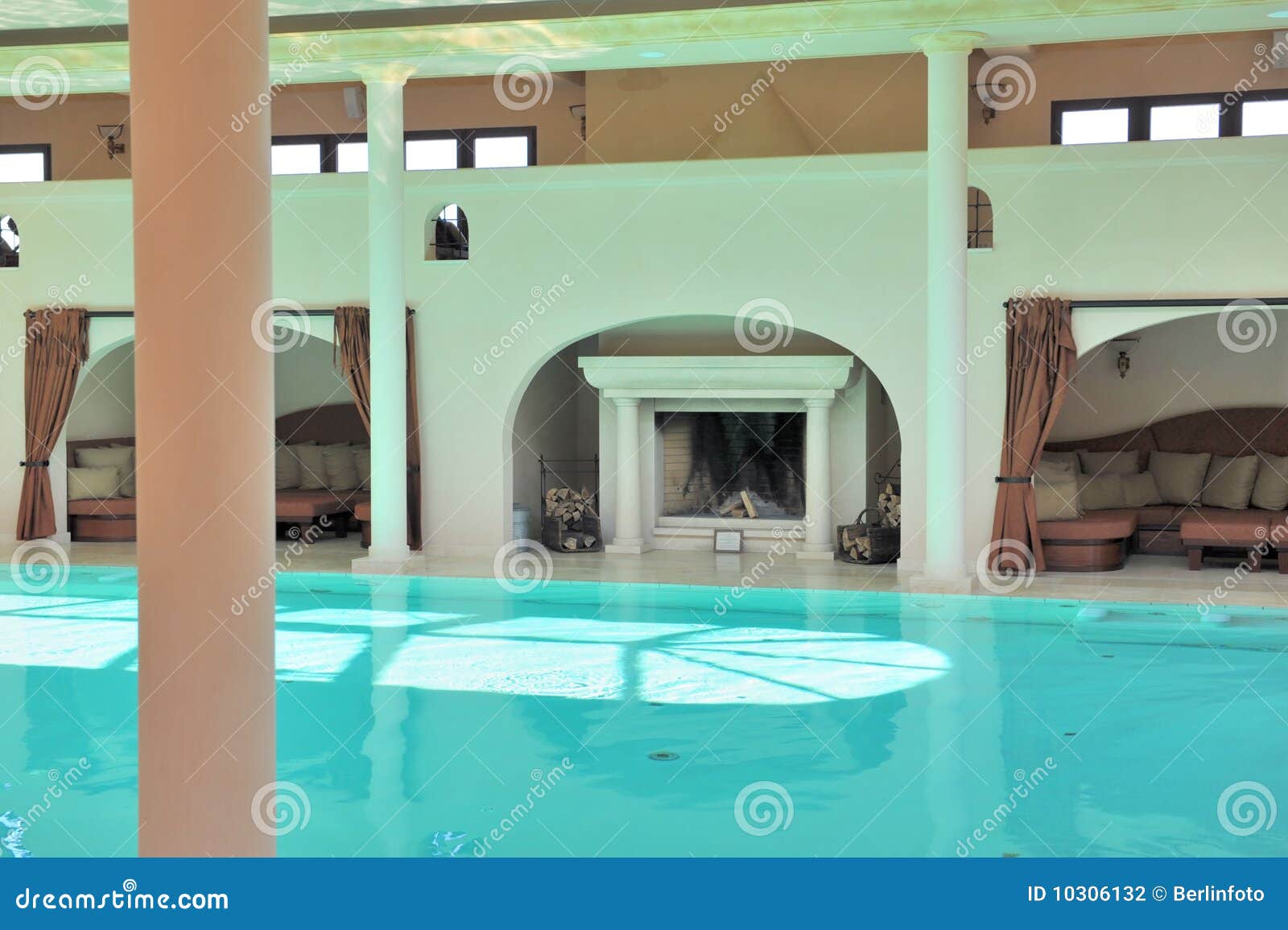 Luxurious Indoor Pool Area With A Sleek Design, Featuring A Swimming ...