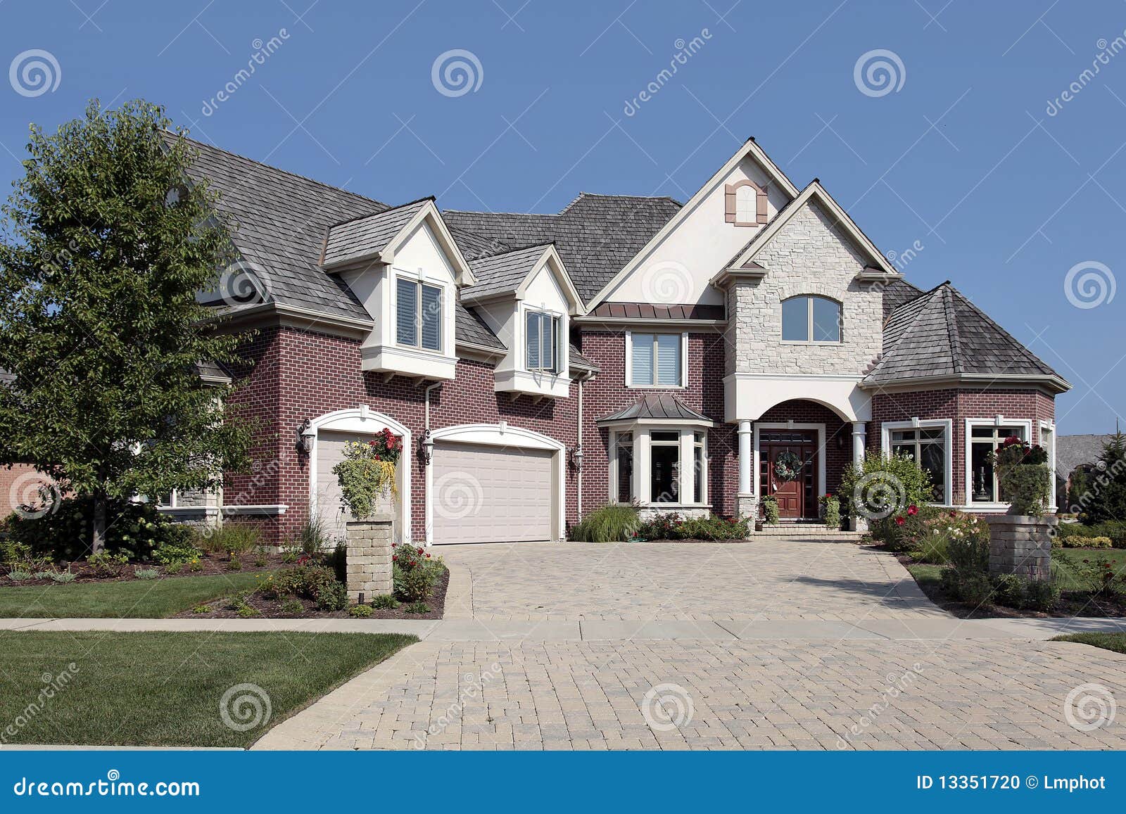 Luxury Brick Home With Stone Pillars Stock Photo - Image: 13351720