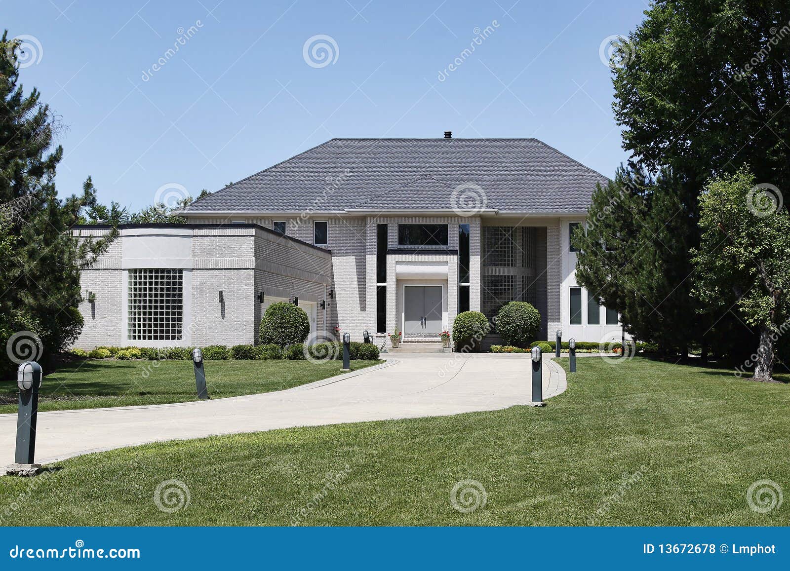 Luxury Home With Curved Garage Window Picture. Image: 13672678