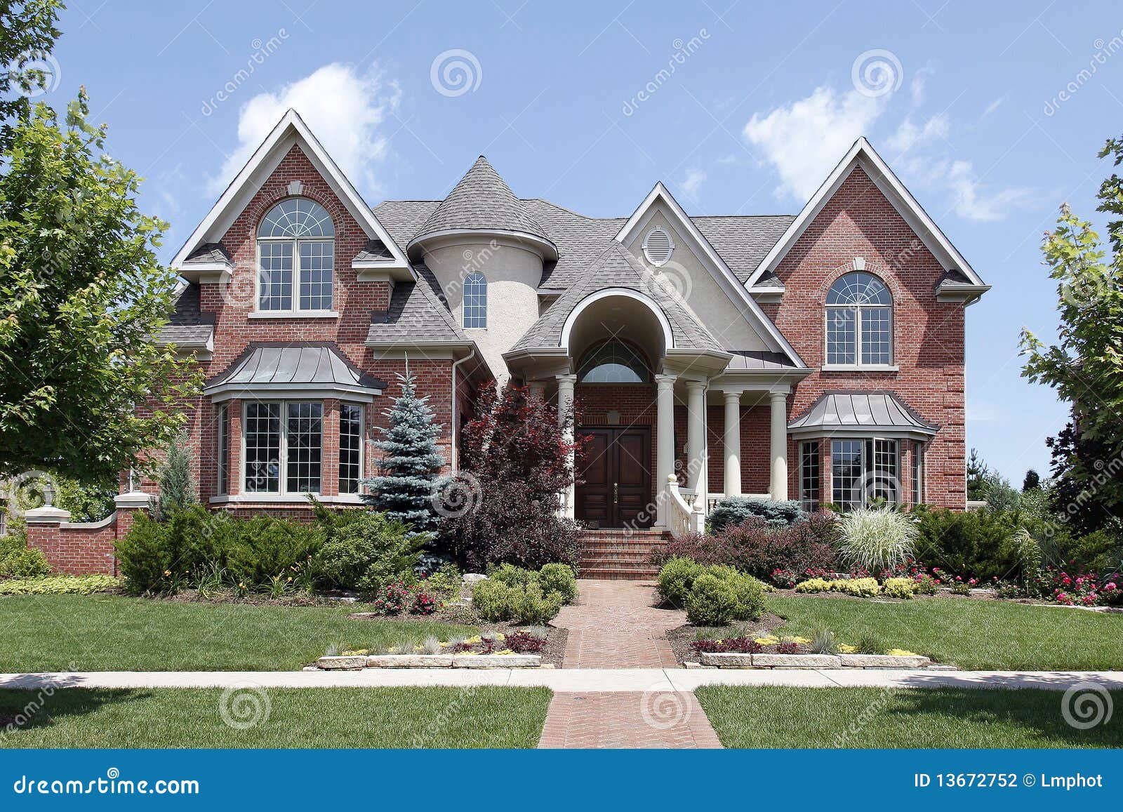 Luxury Home with Turret and Arched Entry Stock Photo - Image of family ...