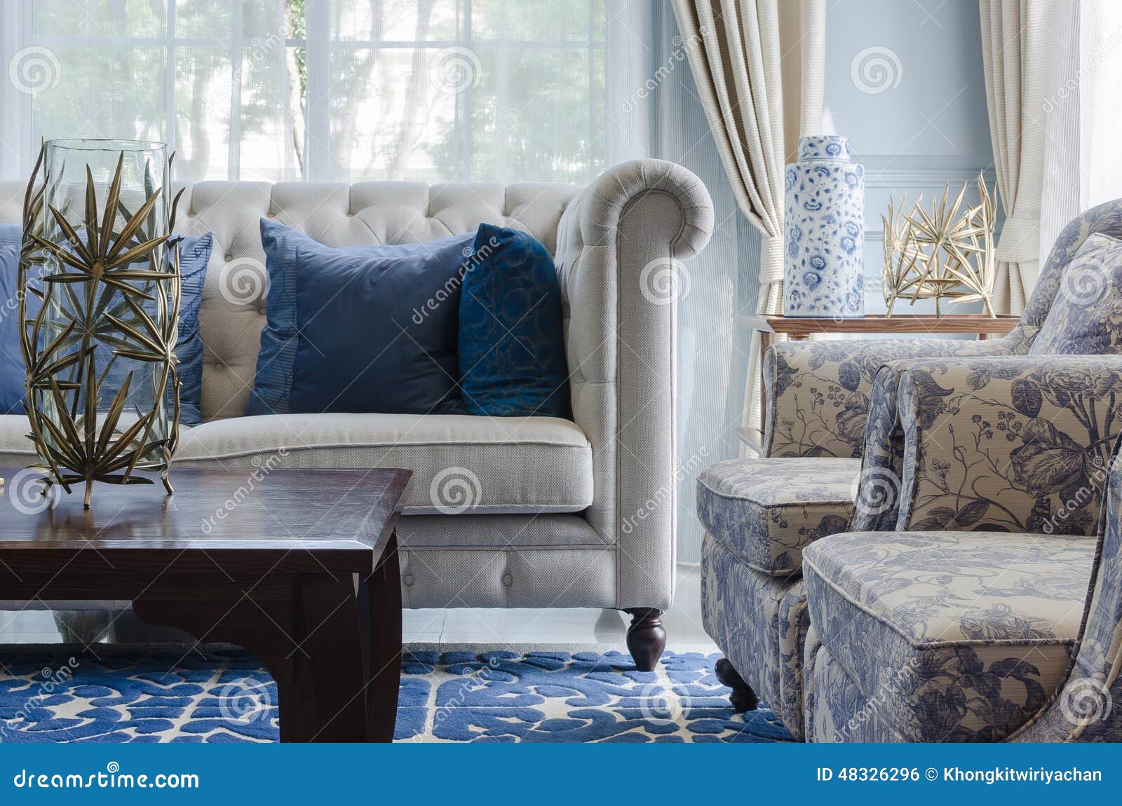 Luxury Living Room with Sofa on Blue Pattern Carpet at Home Stock Photo ...