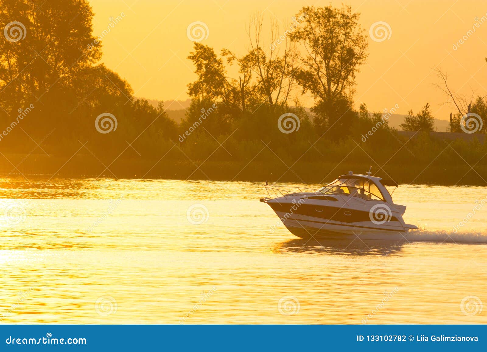 Luxury Motor Boat at Sunset Stock Photo - Image of ship, clouds: 133102782