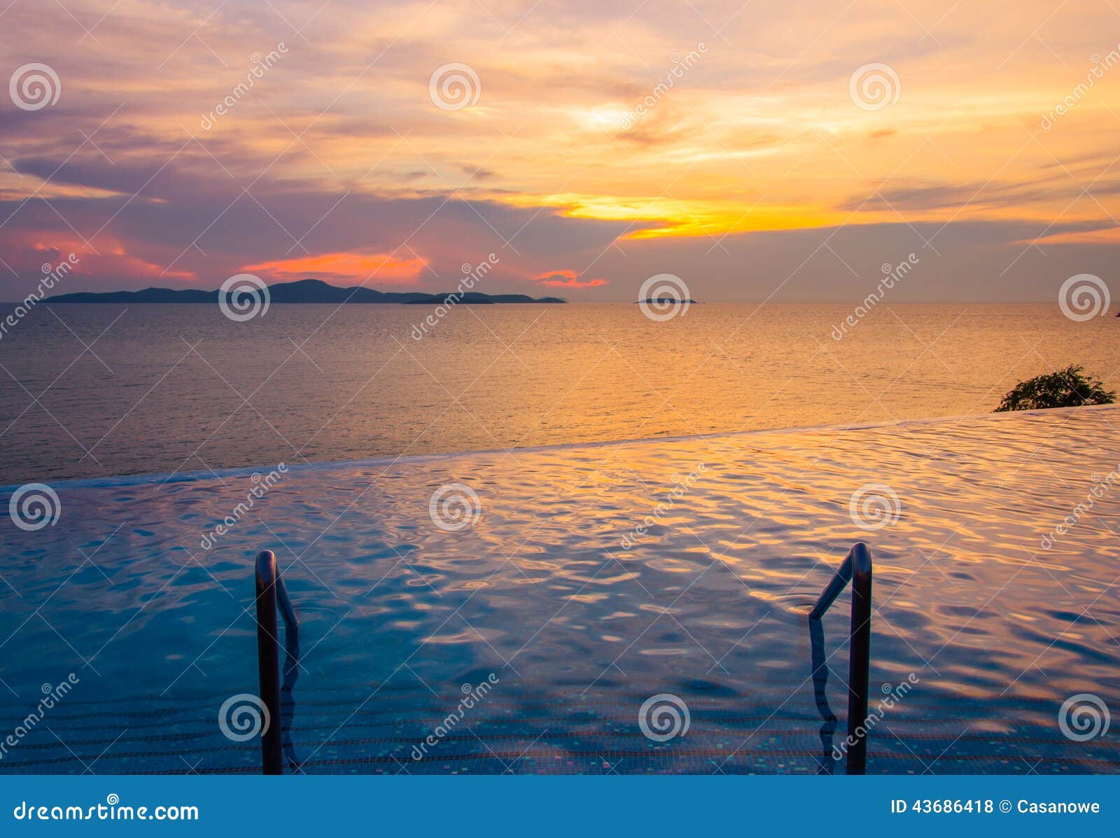Luxury Swimming Pool in Front of Sea at during Sunset Stock Photo ...