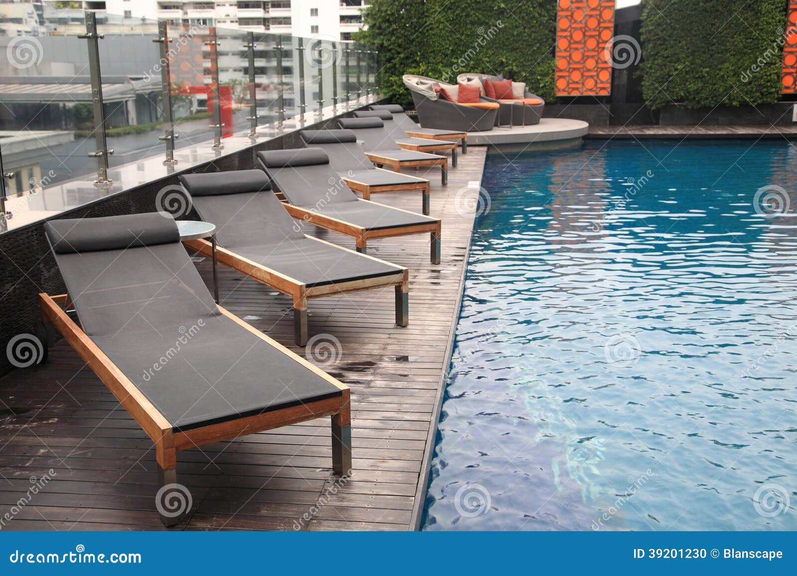 Luxury Swimming Pool with Long Chairs Stock Photo - Image of deck ...