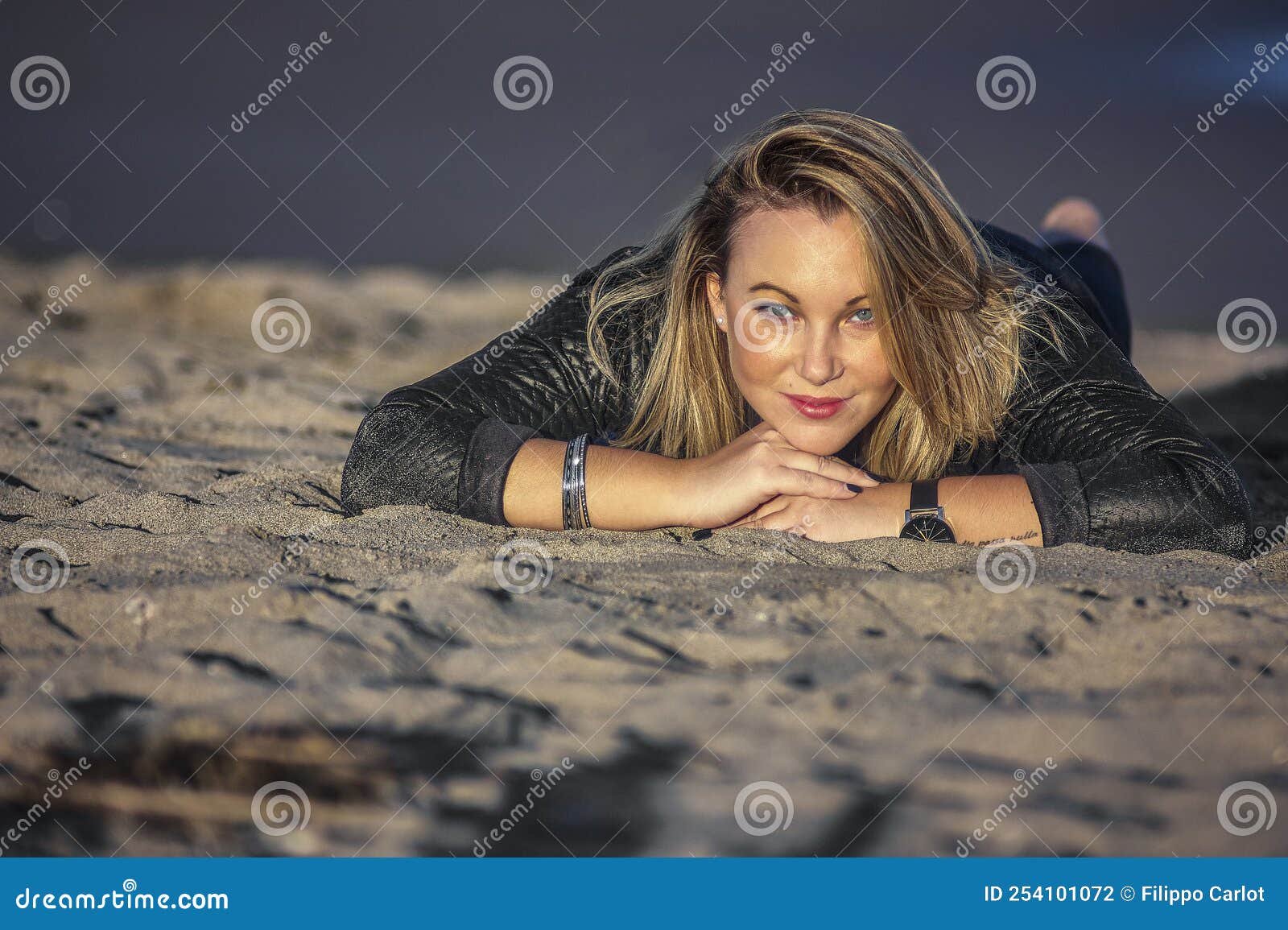 Lying on the sand stock photo. Image of people, relaxing - 254101072