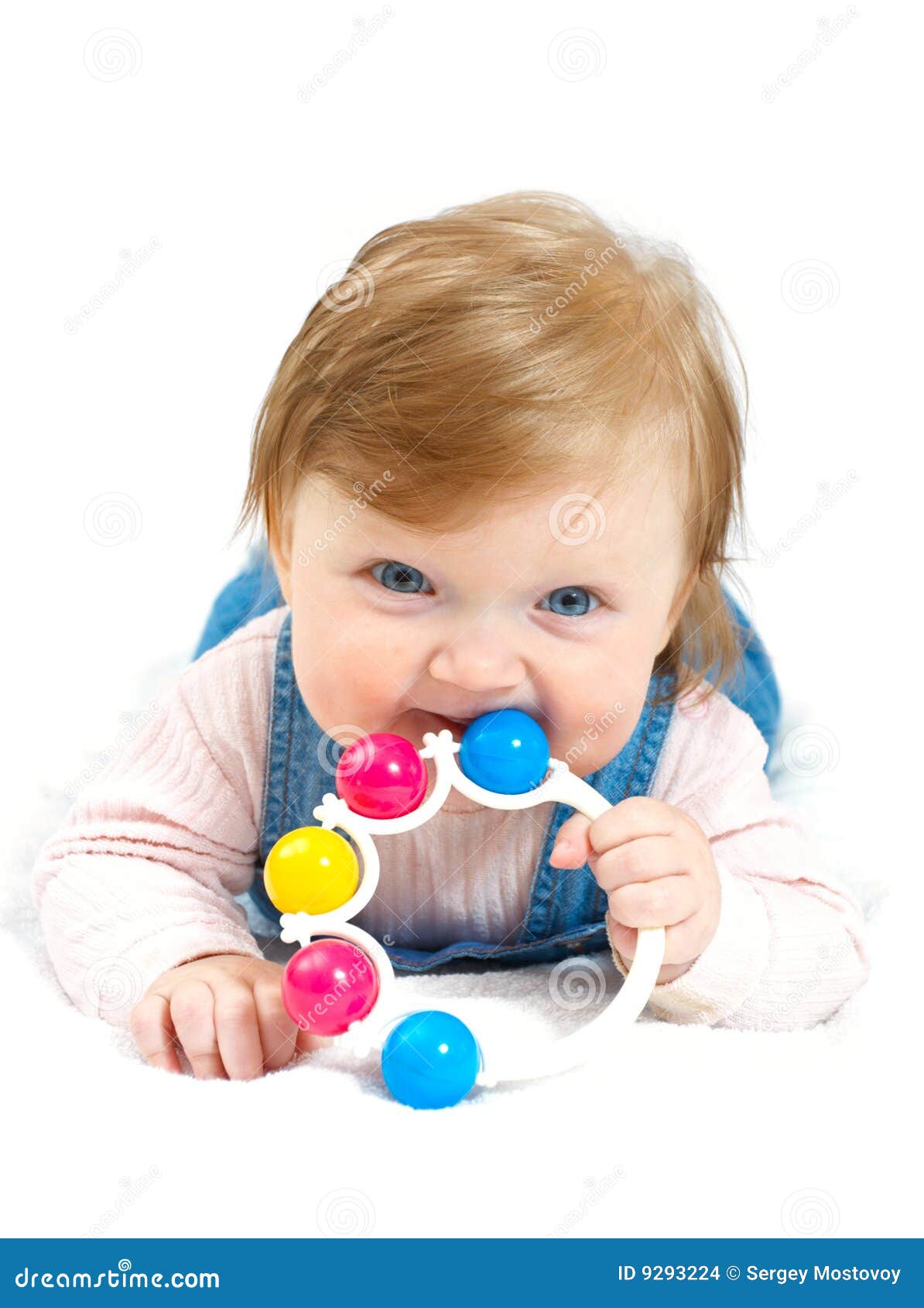 Lying Smiling Child with a Toy Stock Photo - Image of rattle, suit: 9293224