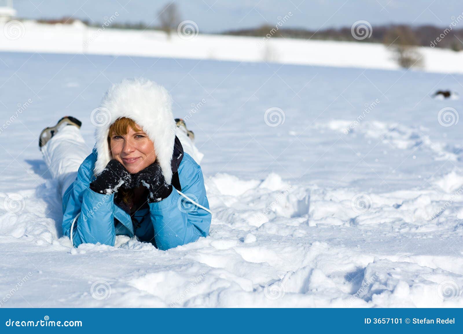 Lying in snow stock image. Image of looking, january, warming - 3657101