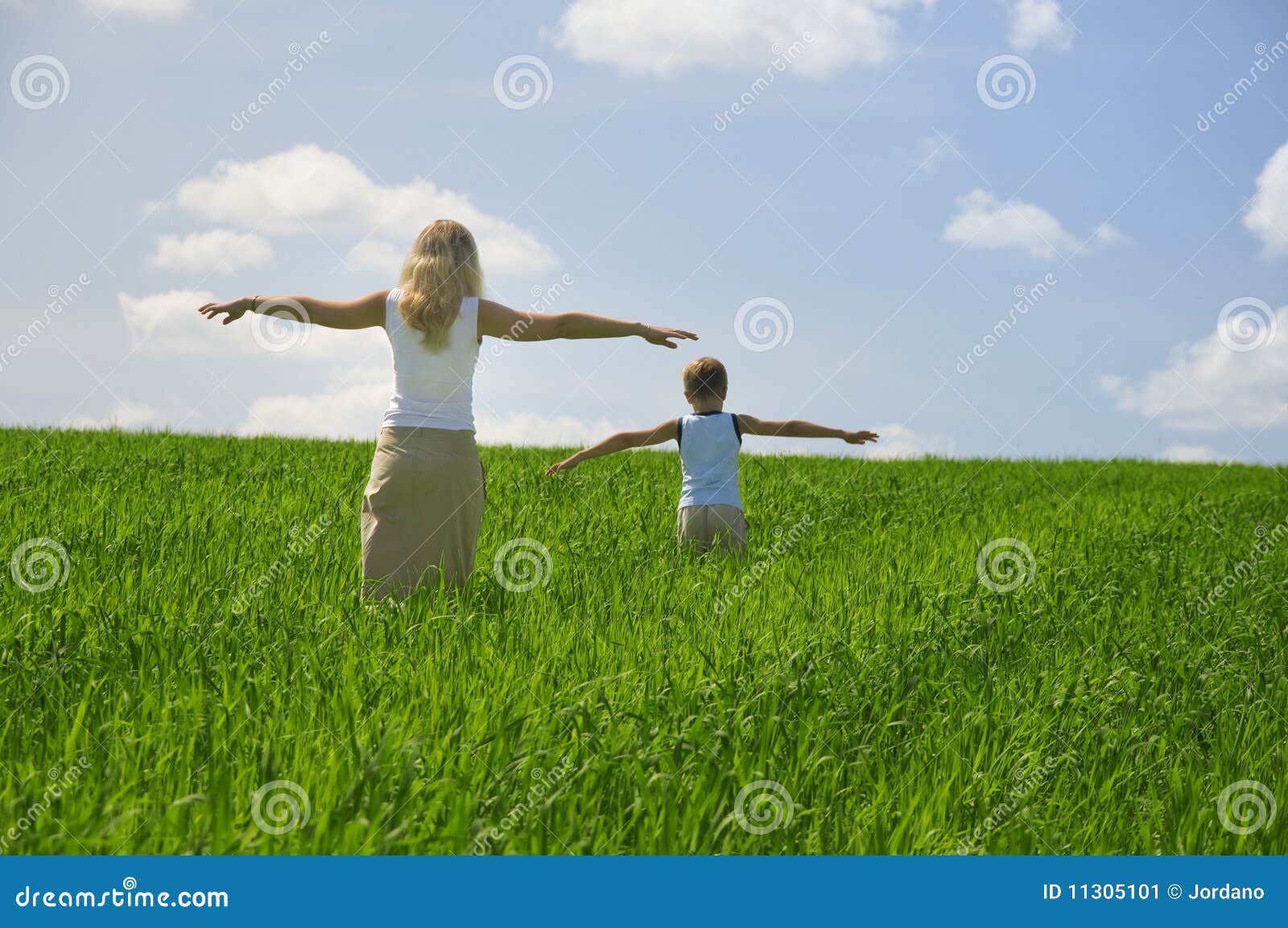 Ma and son walk in field stock image. Image of color - 11305101