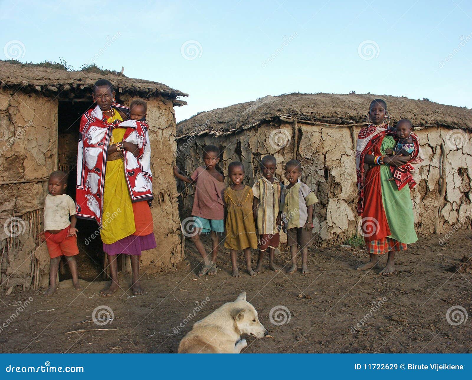 Maasai Family Standing In The Yard Of The Masai Tribe Village House ...