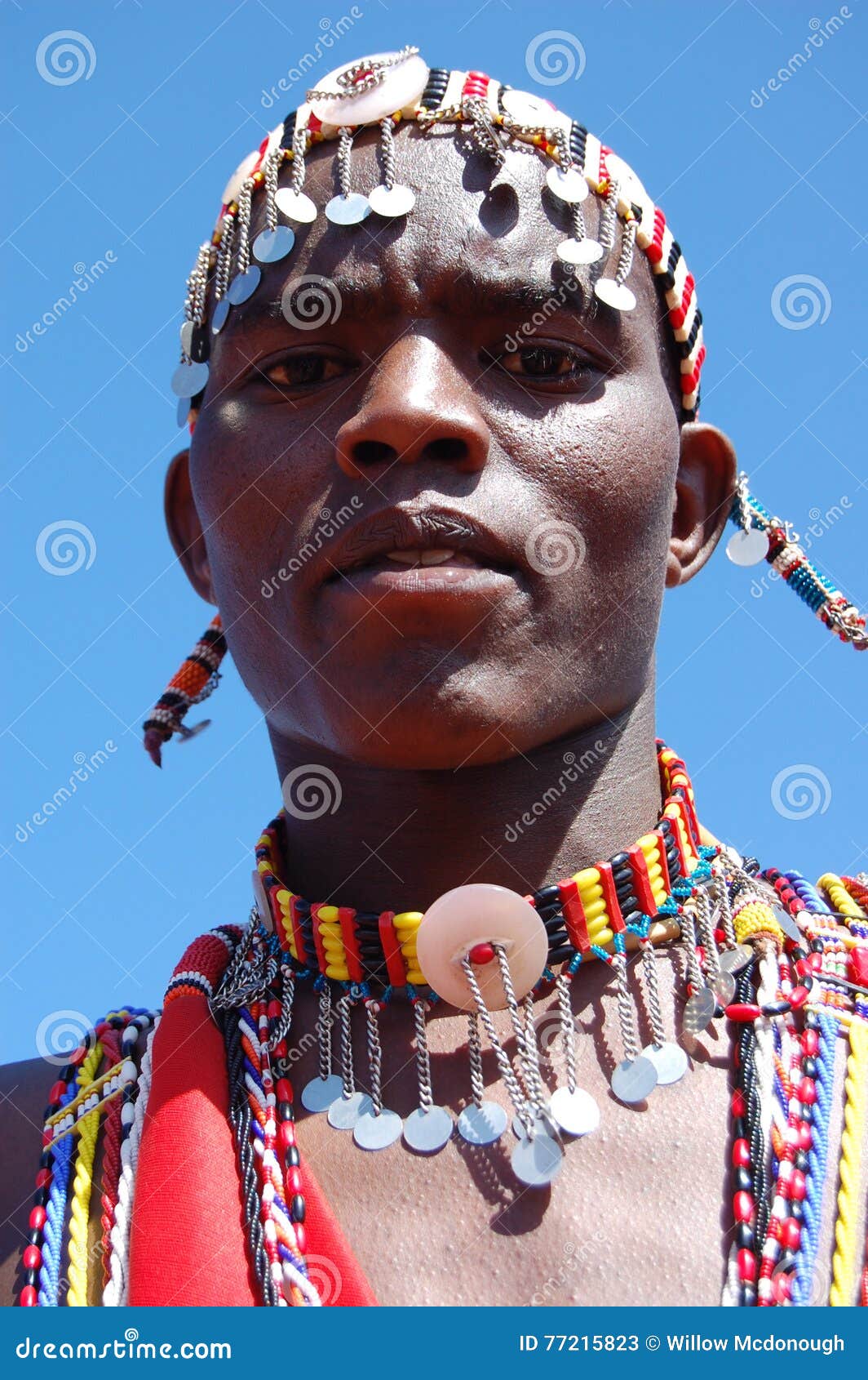 Maasai Man, Warrior, Typical Garb And Male Lion Mane On Head, Spear In ...