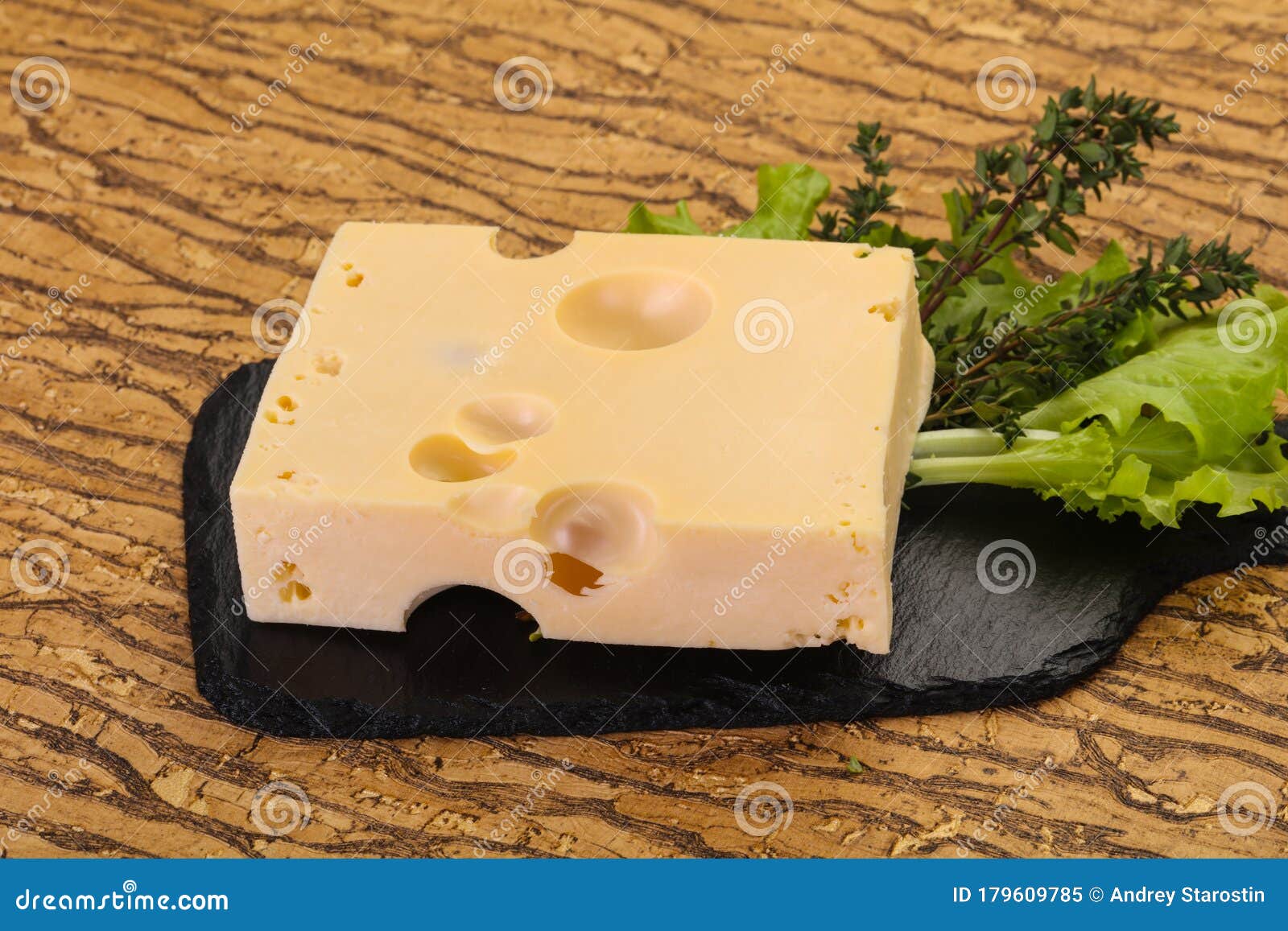 Maasdam cheese brick stock image. Image of wooden, orange - 179609785