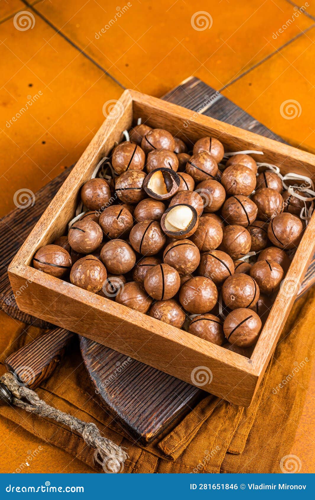 Macadamia Natural Nuts in a Box. Orange Background Stock Photo - Image ...