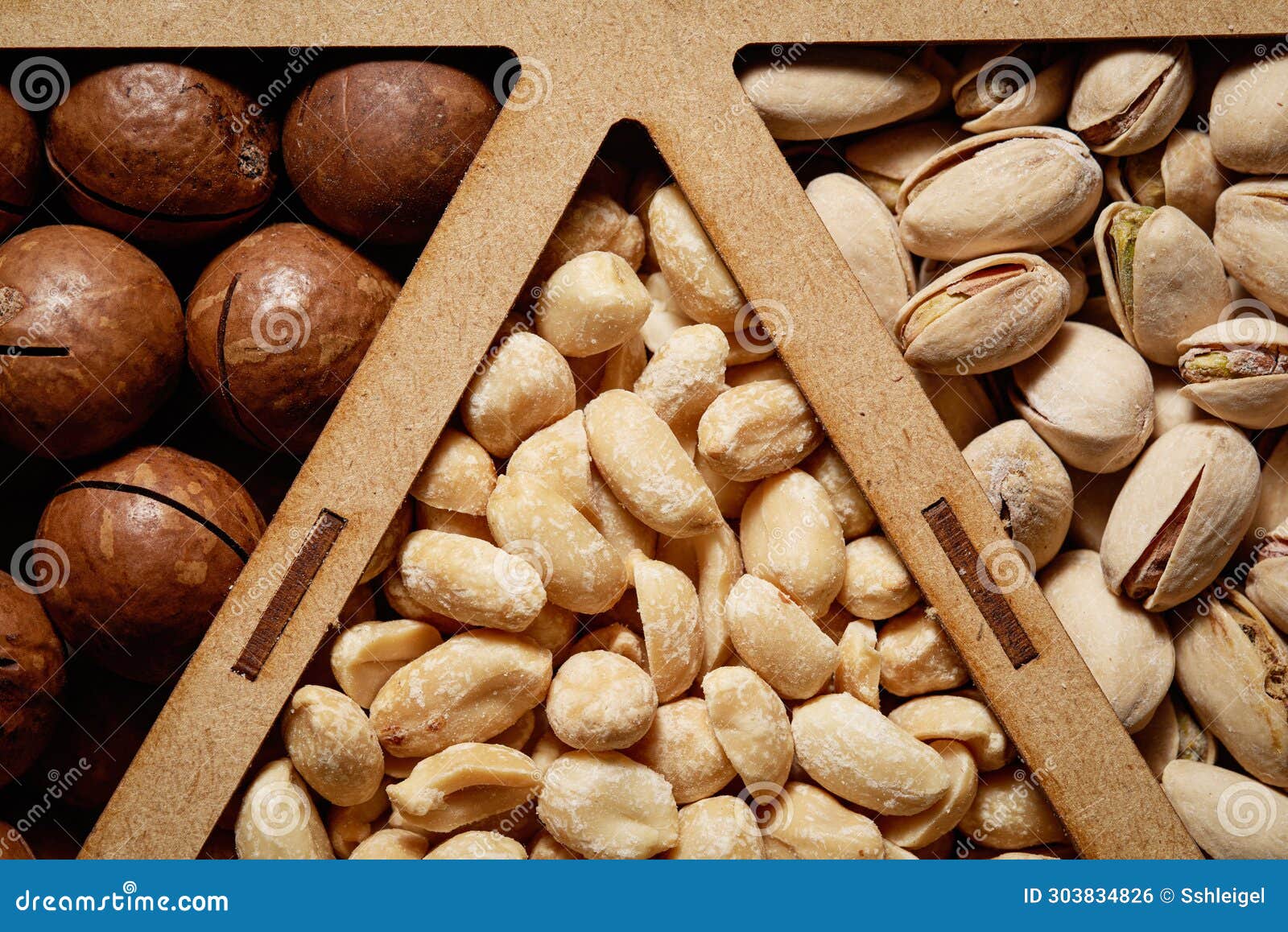 Macadamia Nuts, Peanuts and Cashews in a Box on Display. Top View Stock ...