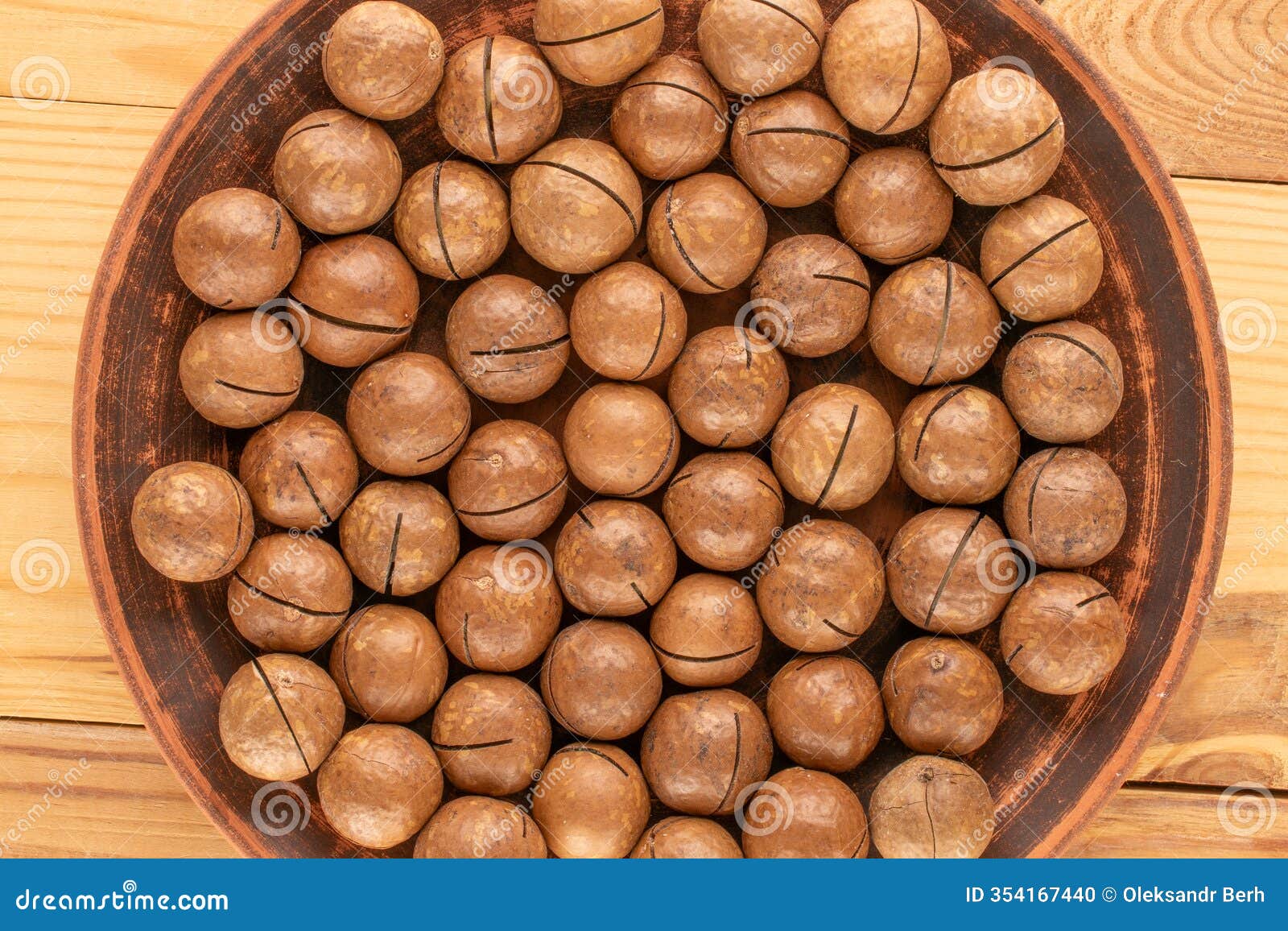 Macadamia Nuts in Shell with Kitchen Utensils, Close-up, Isolated on ...