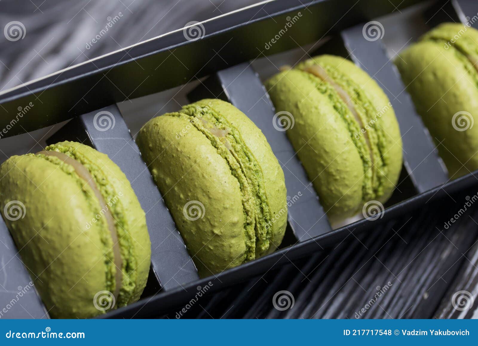 Macarons Cakes Light Green Color. They Lie On Black And White Pine ...