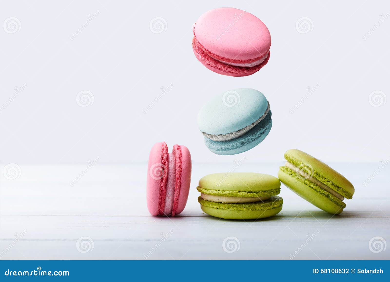 Macaroons in Motion on White Background Stock Photo - Image of cookies ...