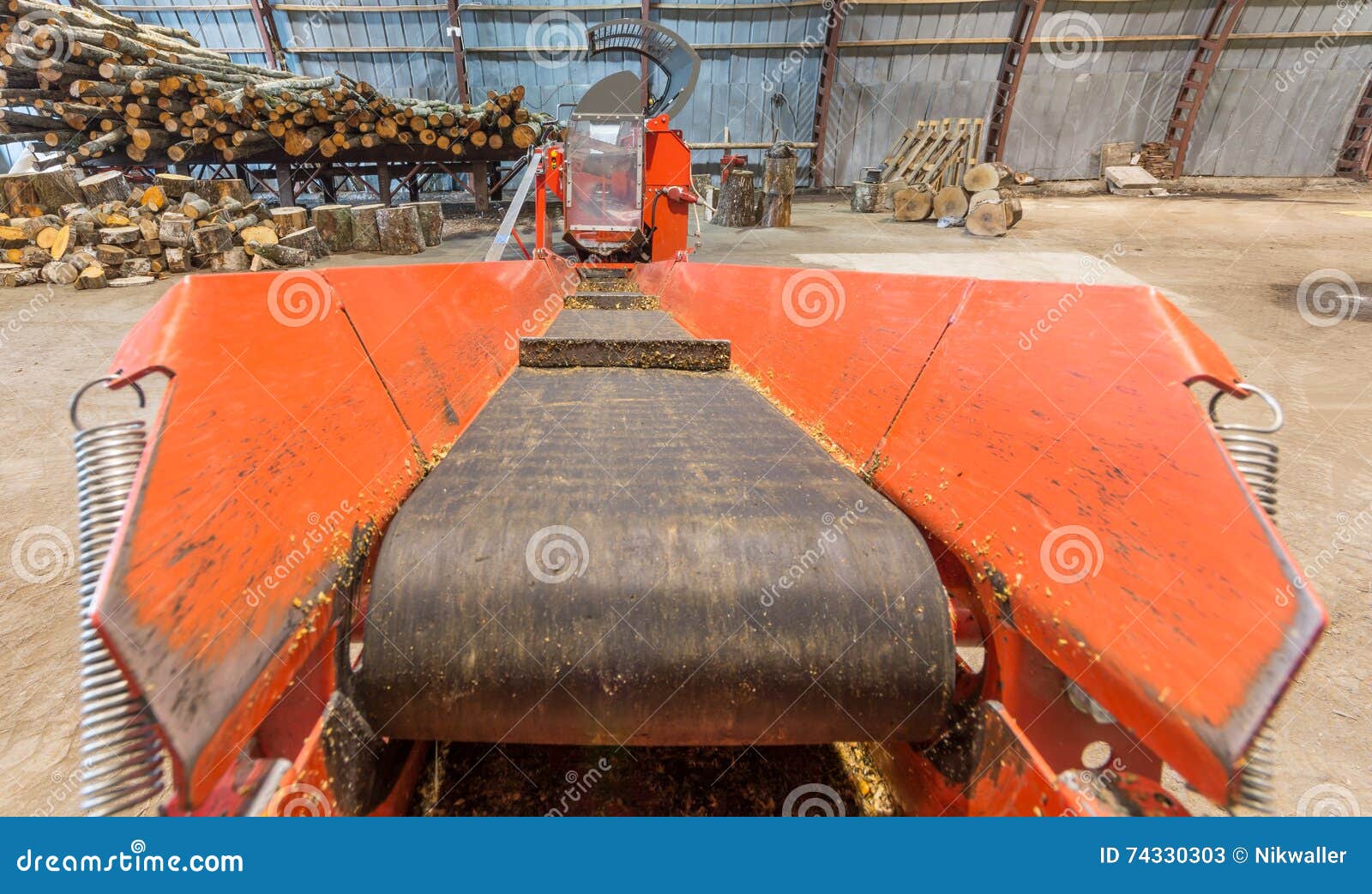 Machine for Chopping Firewood. Firewood Processor in Big Warehouse ...
