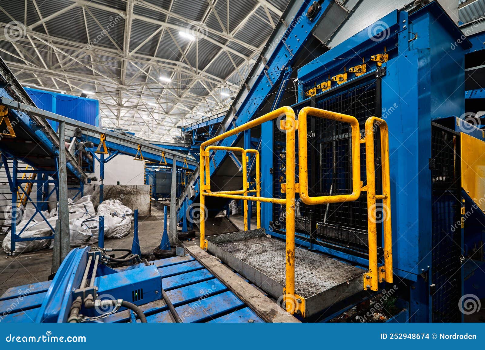 Machine for Compacting Household Waste. Compaction of Garbage into ...