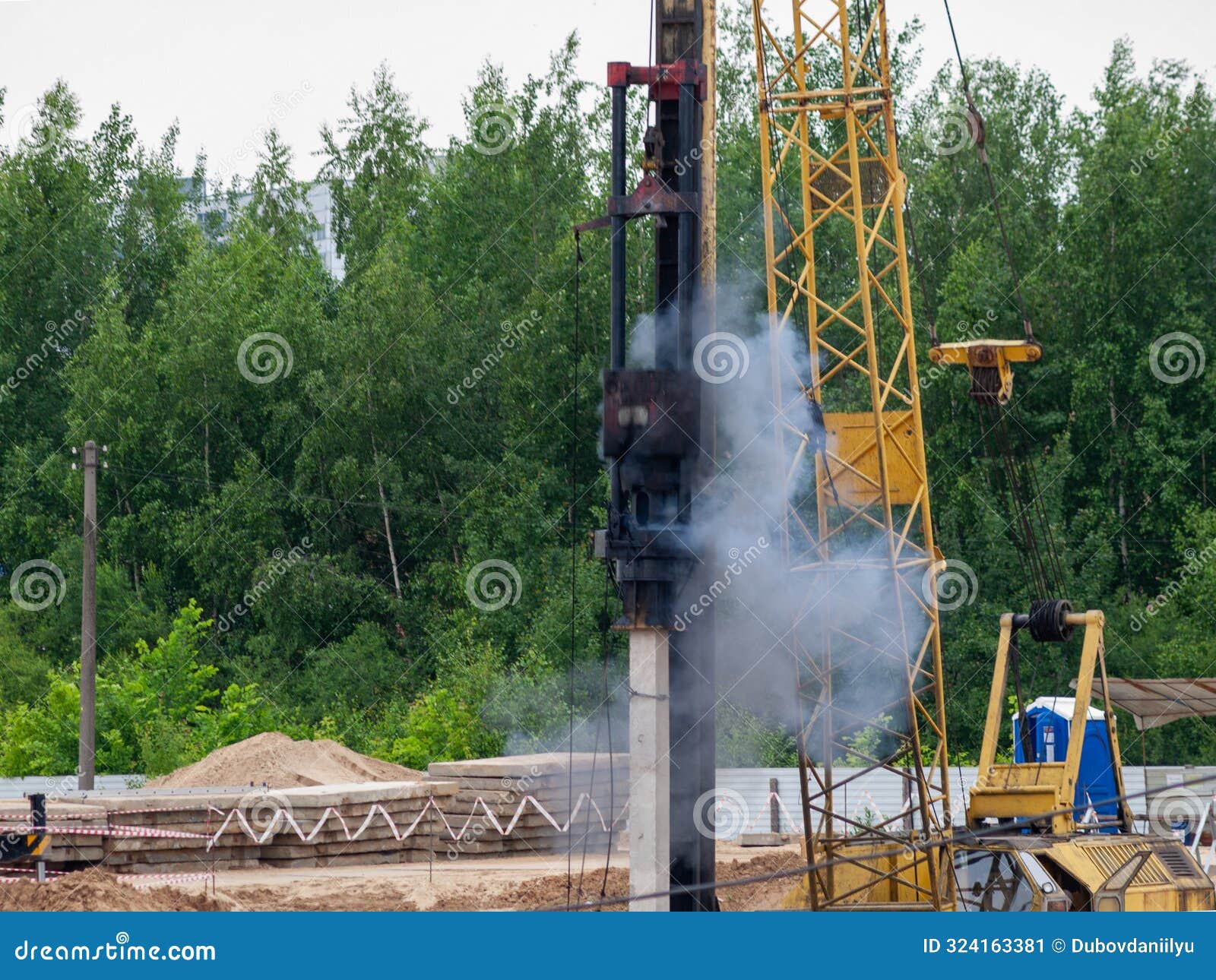 A Machine Driving Piles at Construction Sites during the Construction ...